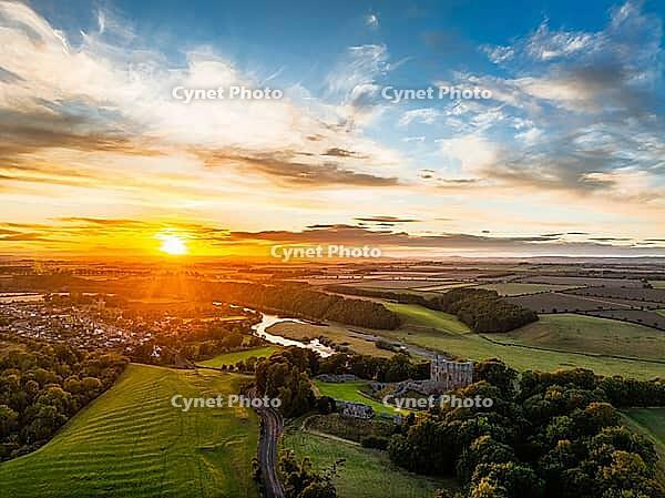 Sunset over Norham Castle and River Tweed from a drone, Norham ...