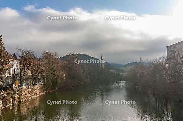 View of the river mur river, in the back the church tower of the ...